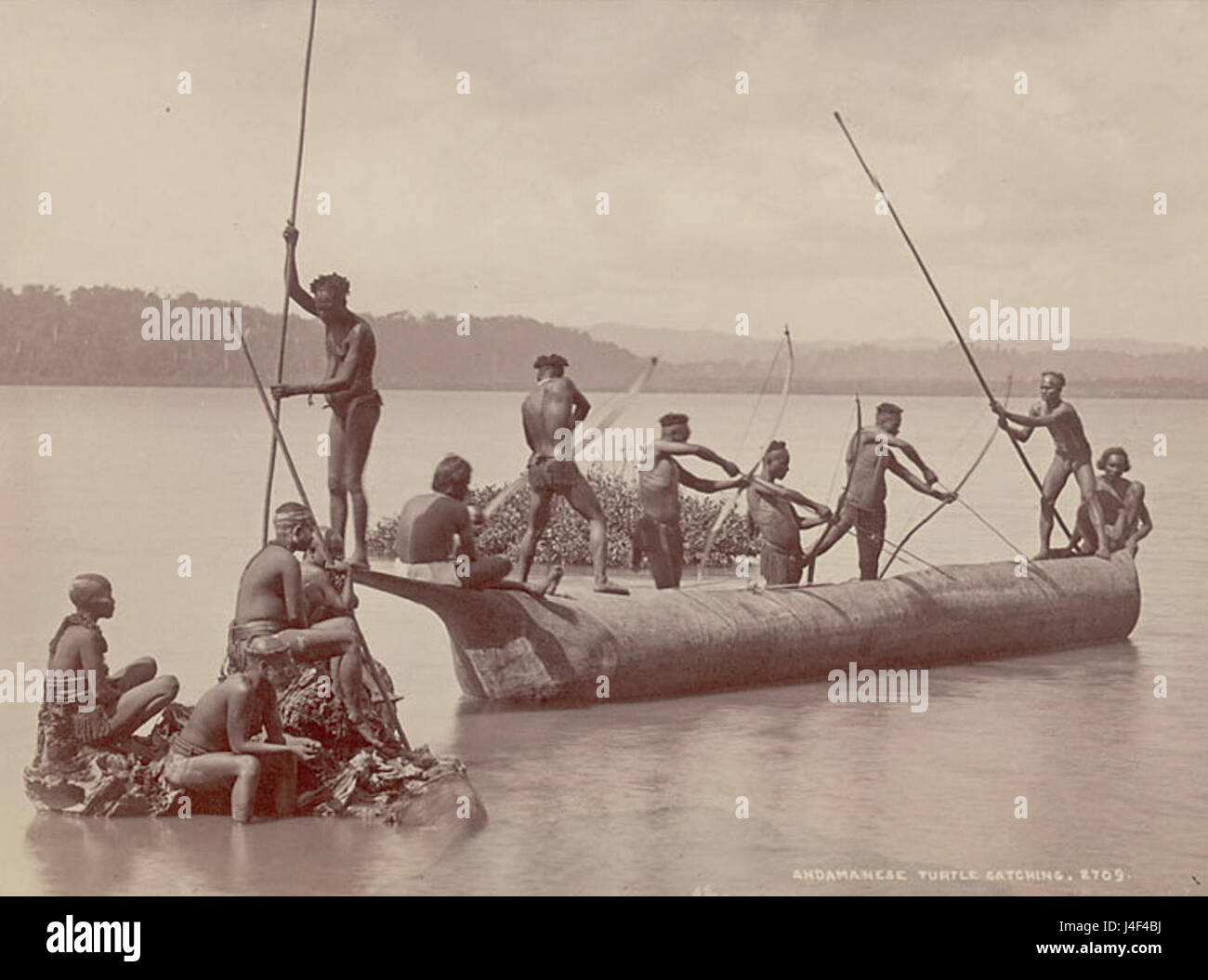 This image portrays a group of Andaman Islanders in traditional costume ...