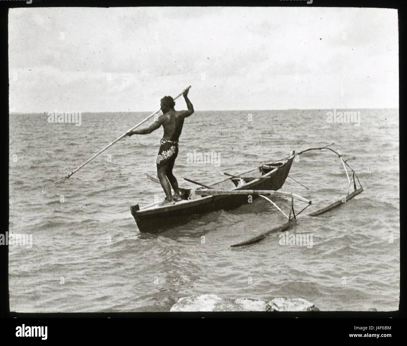 A Polynesian outrigger canoe is shown in a historical image from the ...
