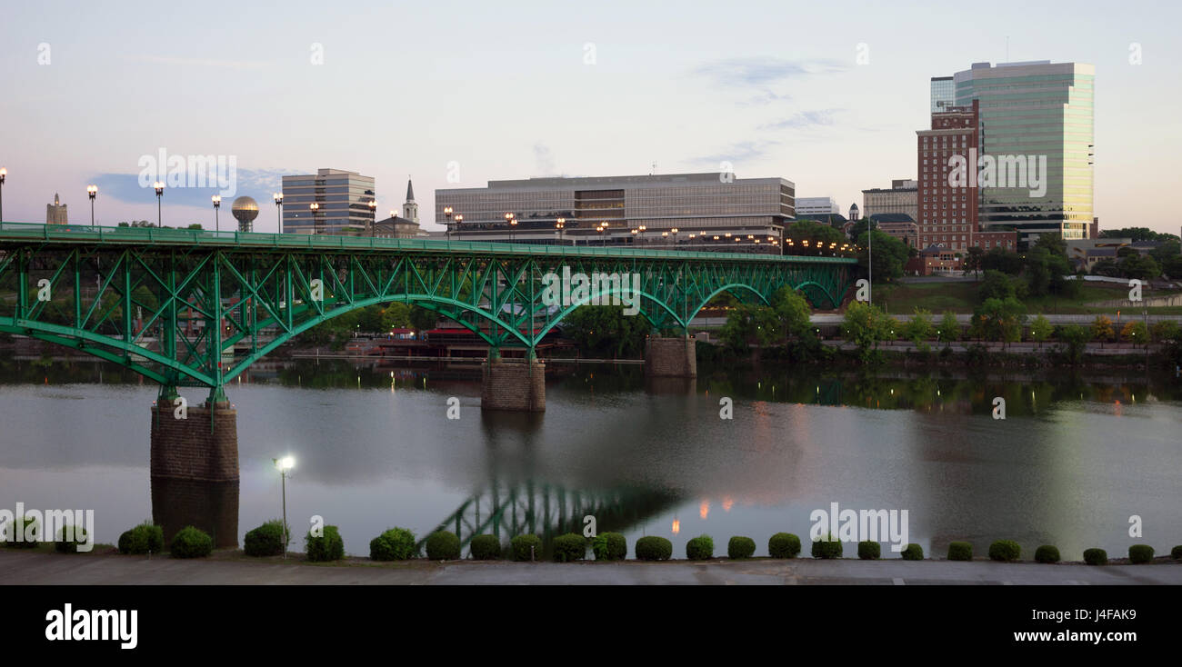The river is serene showing the city reflection at sunrise in Knoxville ...