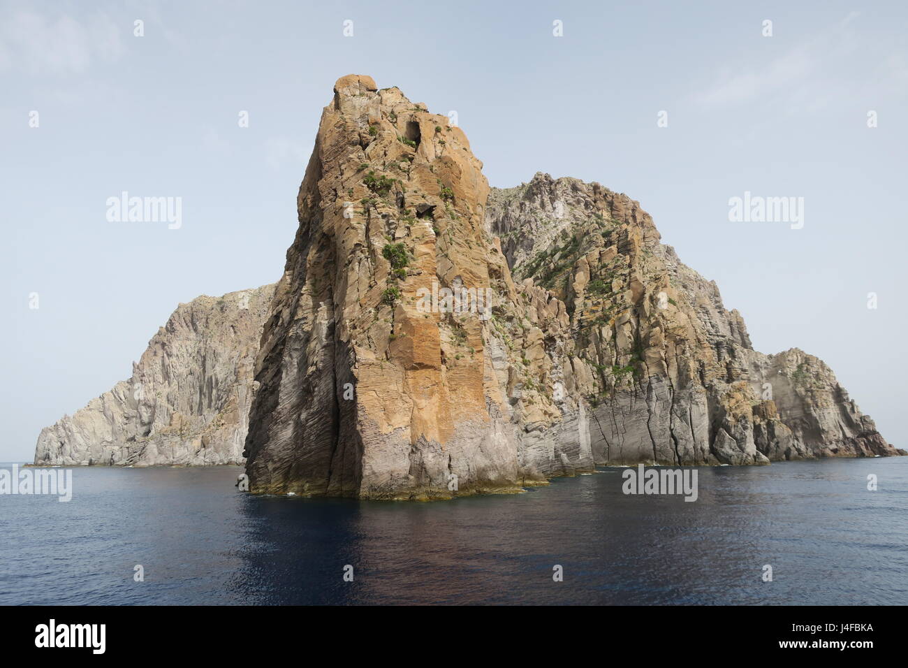 There's an interesting mighty rock in a sea near Panarea island on ...