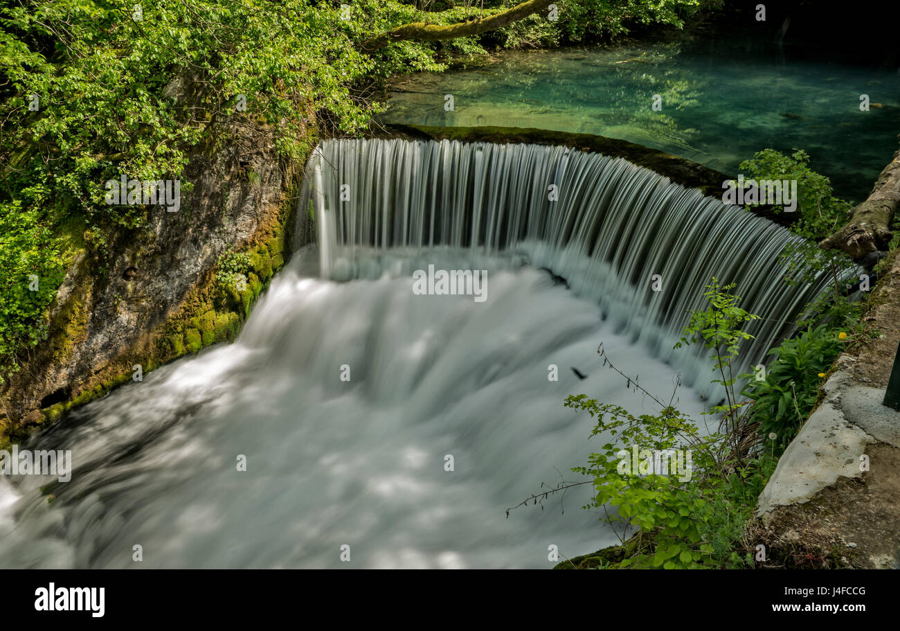 Semicircular dam that cause waterfall Stock Photo - Alamy