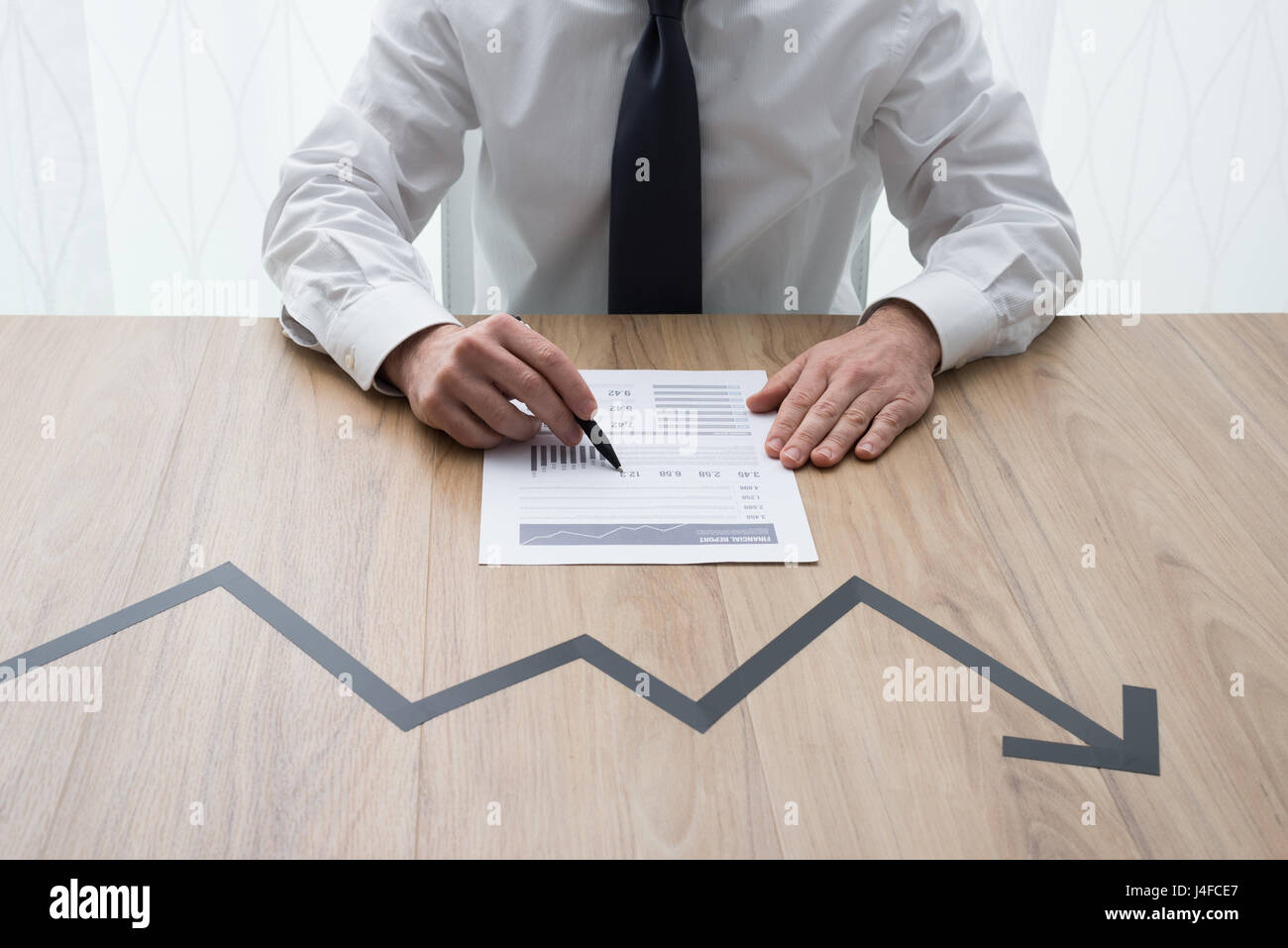 Manager checking a financial report and conceptual negative financial ...