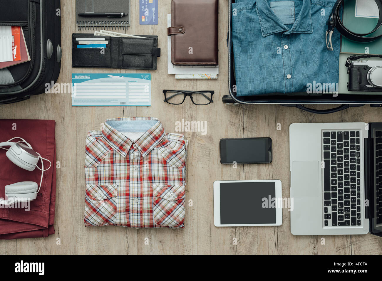 Getting ready for a trip and packing a suitcase before leaving ...