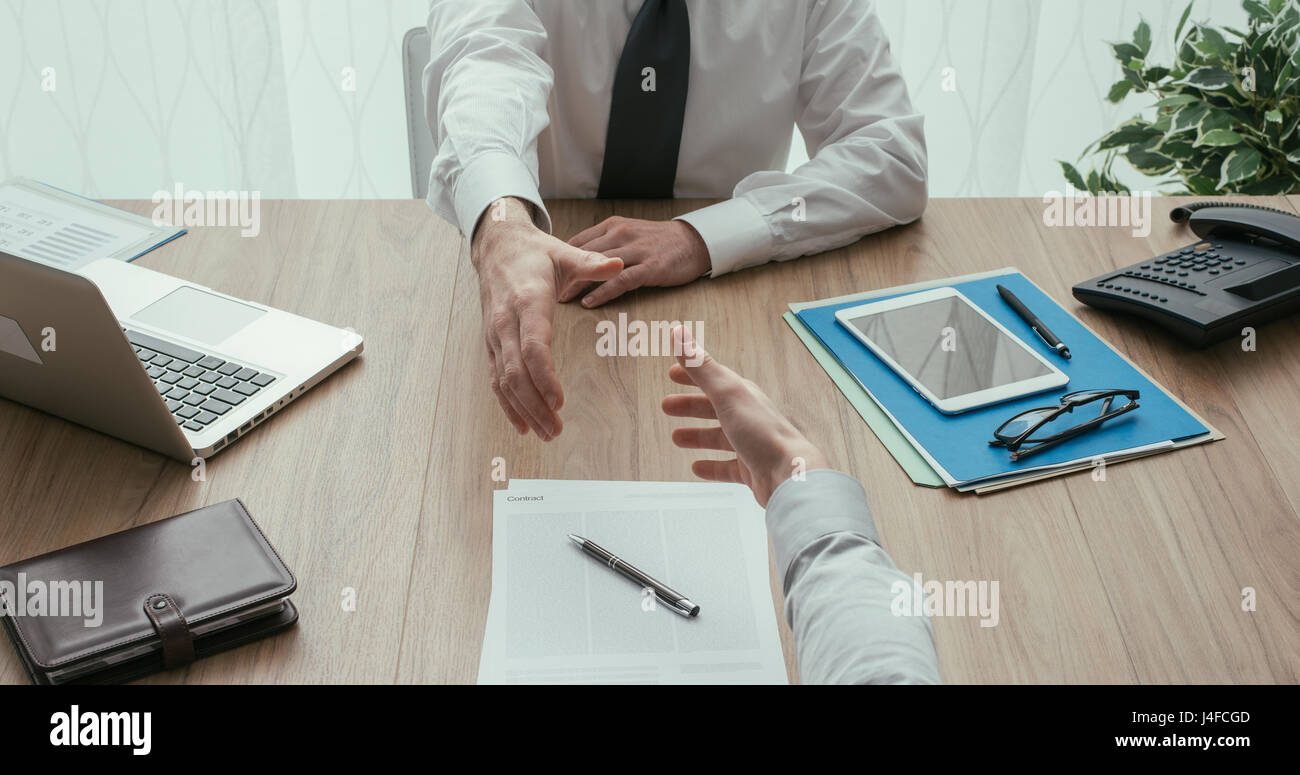 Businessman and customer having a business meeting in the office before ...