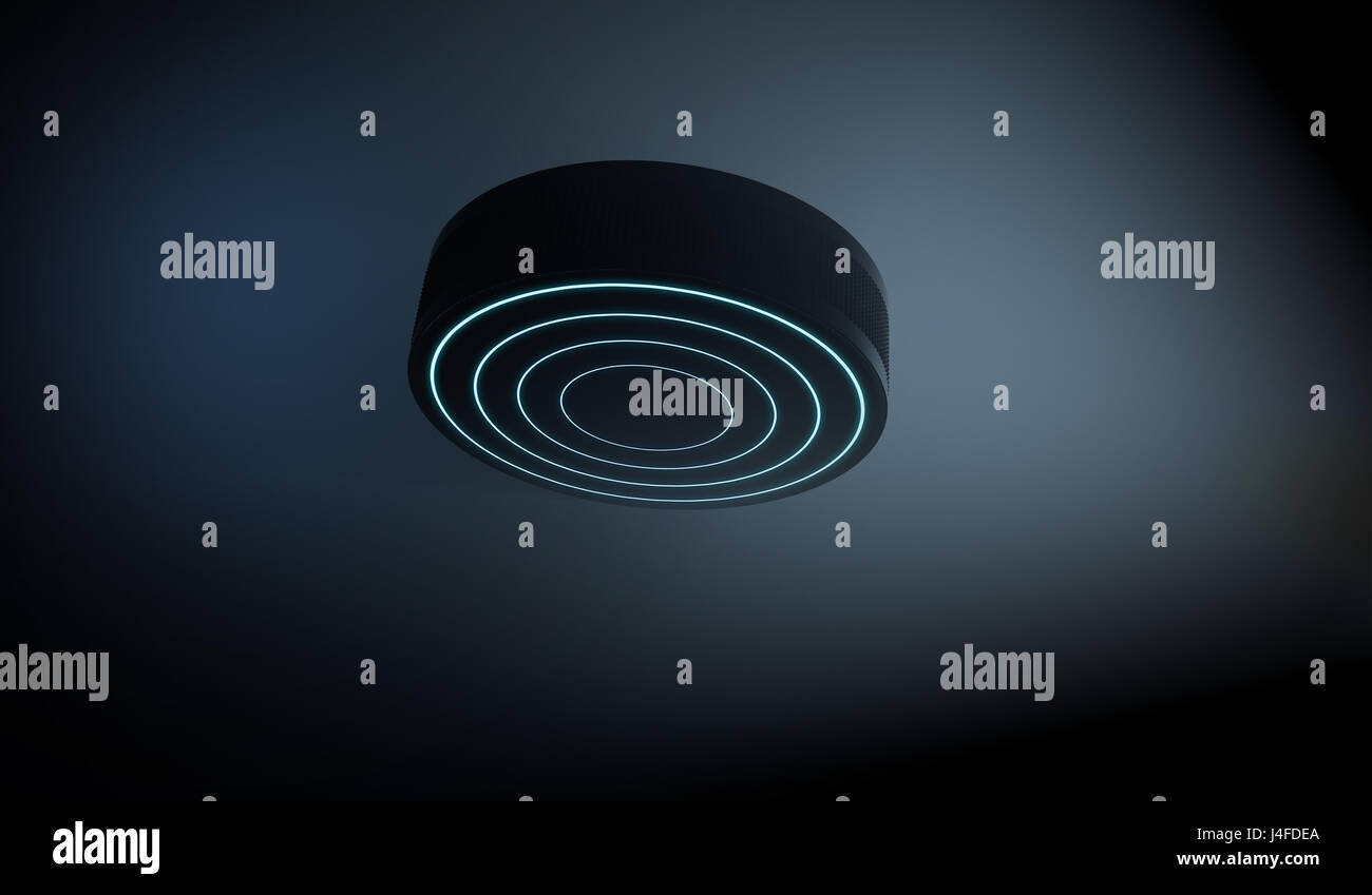 A futuristic sports concept of a black textured hockey puck lit with ...