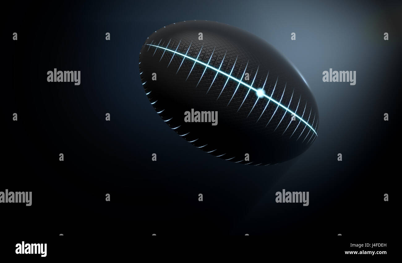 A futuristic sports concept of a black textured rugby ball lit with ...