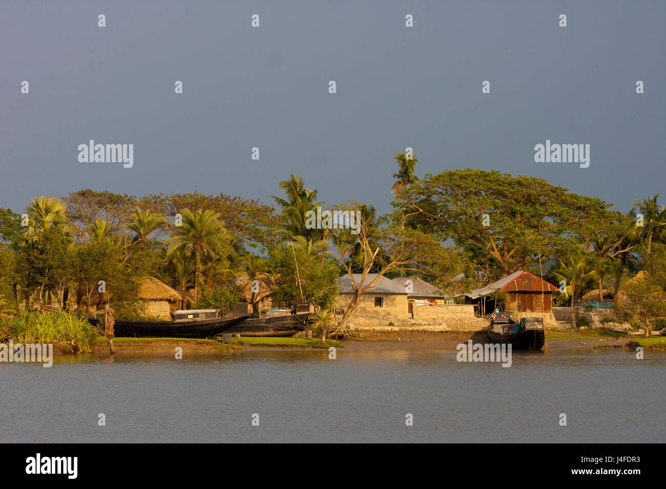 A village at the bank of Pasur River at Mongla. Bagerhat, Bangladesh ...