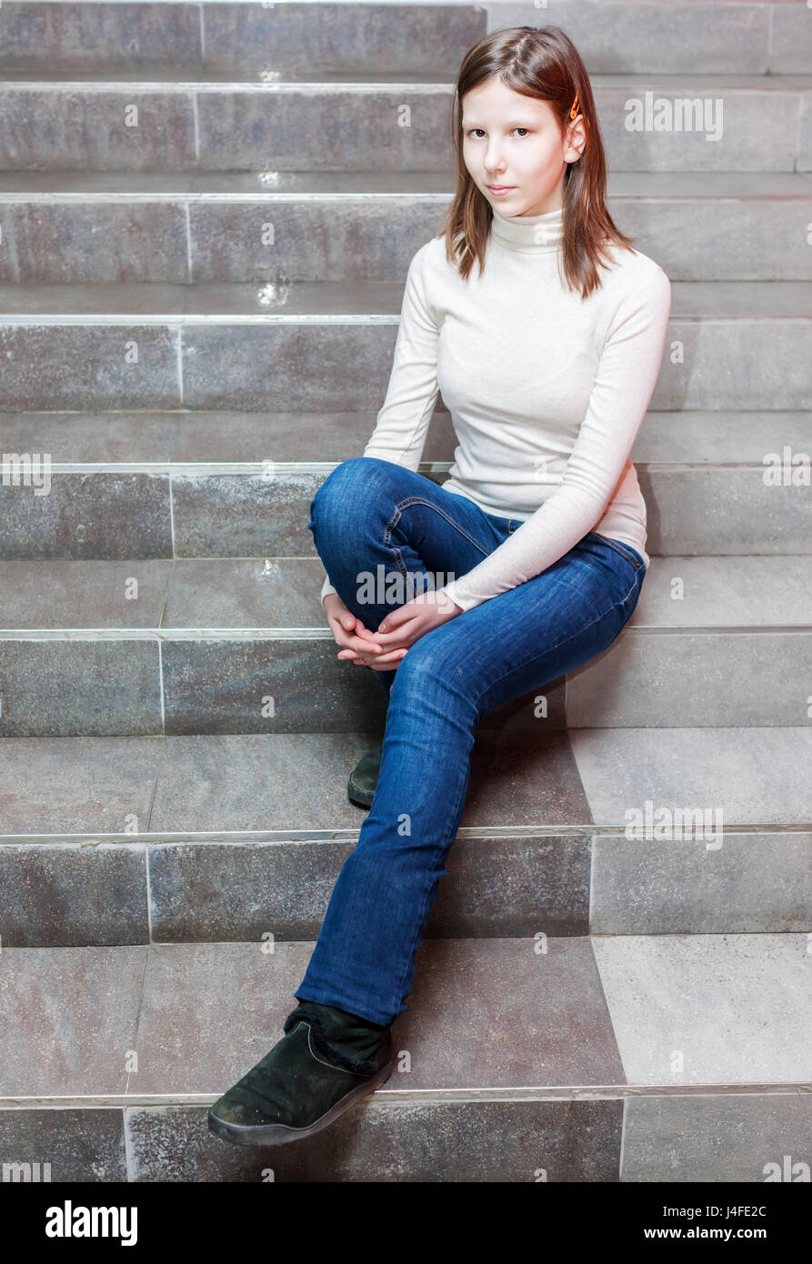 Teen girl sitting on stairs hi-res stock photography and images - Alamy