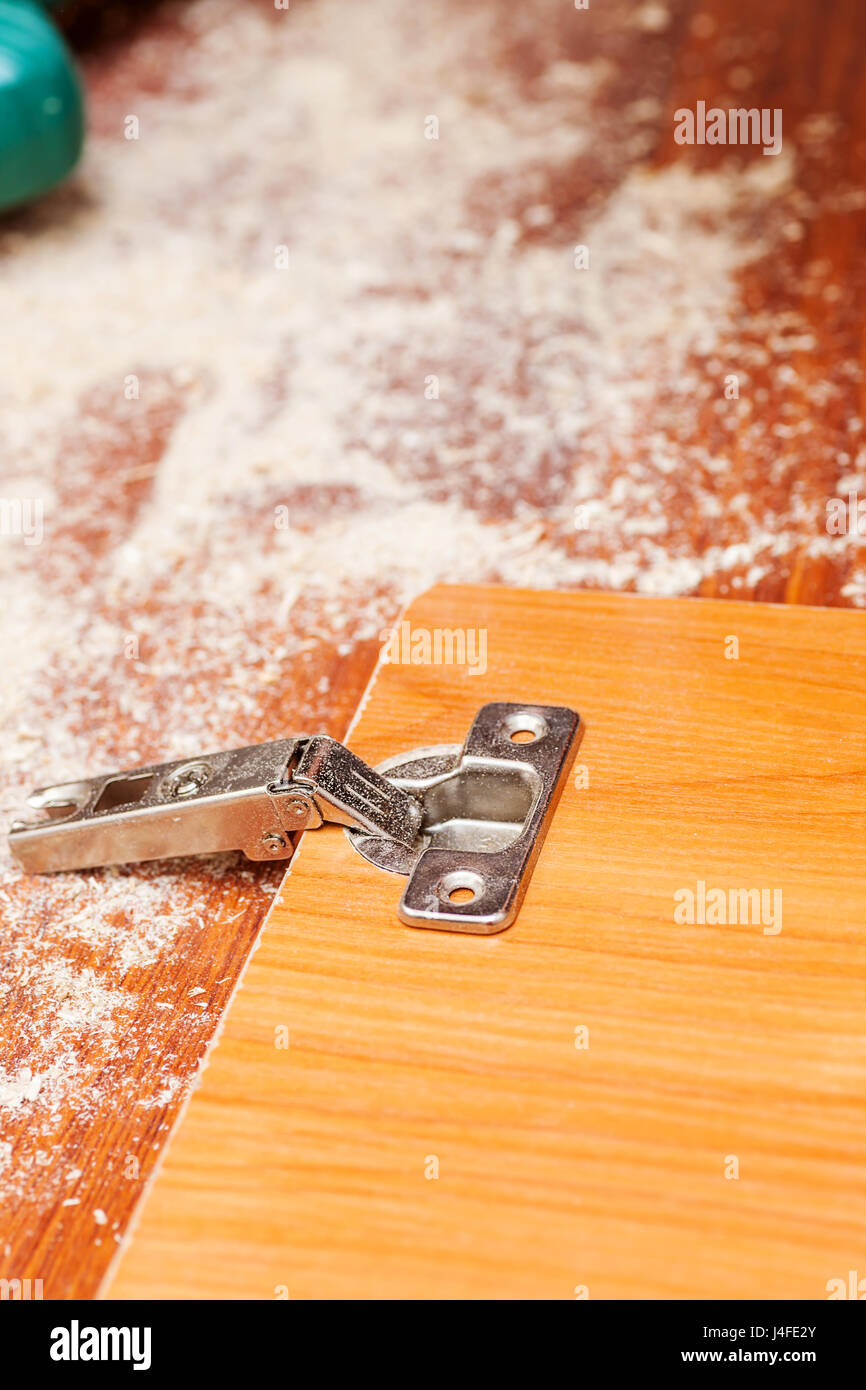 concealed hinge Installation in wooden door with sawdust Stock Photo ...
