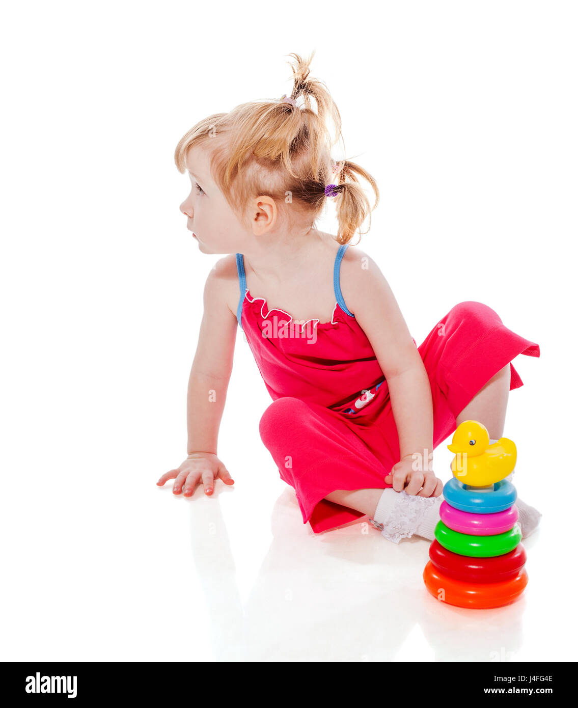 Little girl playing with pyramid isolated on white Stock Photo - Alamy