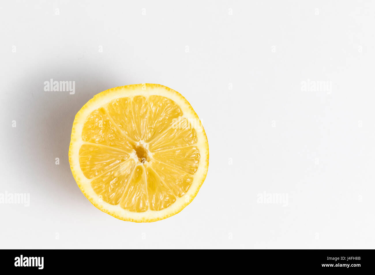 Single half lemon on white background from above Stock Photo - Alamy