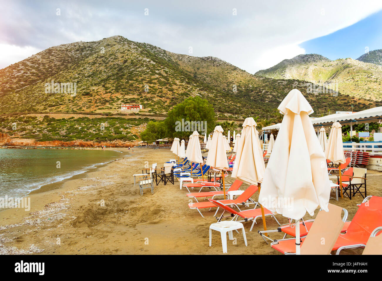 Sunny sandy Livadi beach in sea bay of resort village Bali in may ...