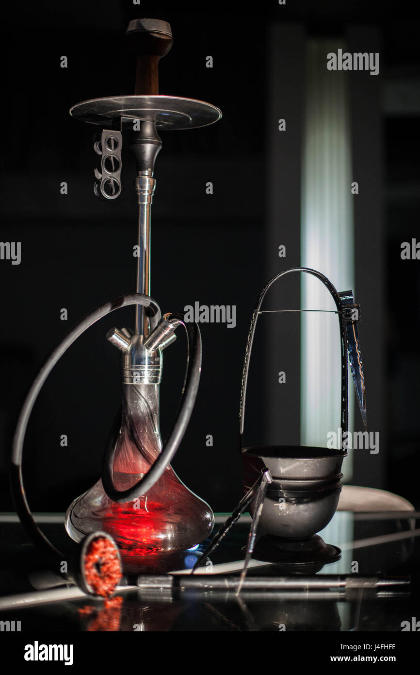 The red shisha on a dark background Stock Photo - Alamy