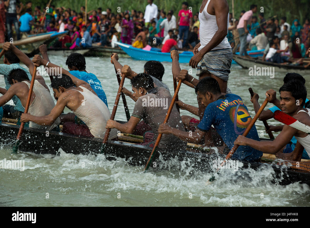 A traditional boat race is underway on the Ichamati River at Jhitka in ...