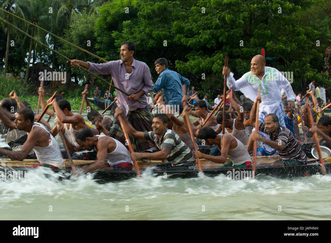 A traditional boat race is underway on the Ichamati River at Jhitka in ...