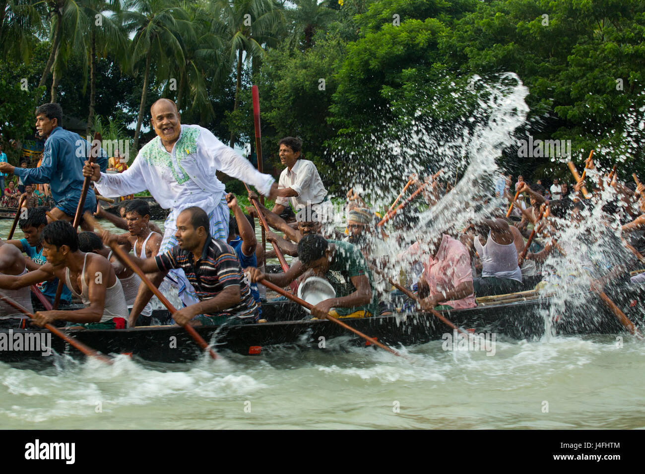 A traditional boat race is underway on the Ichamati River at Jhitka in ...