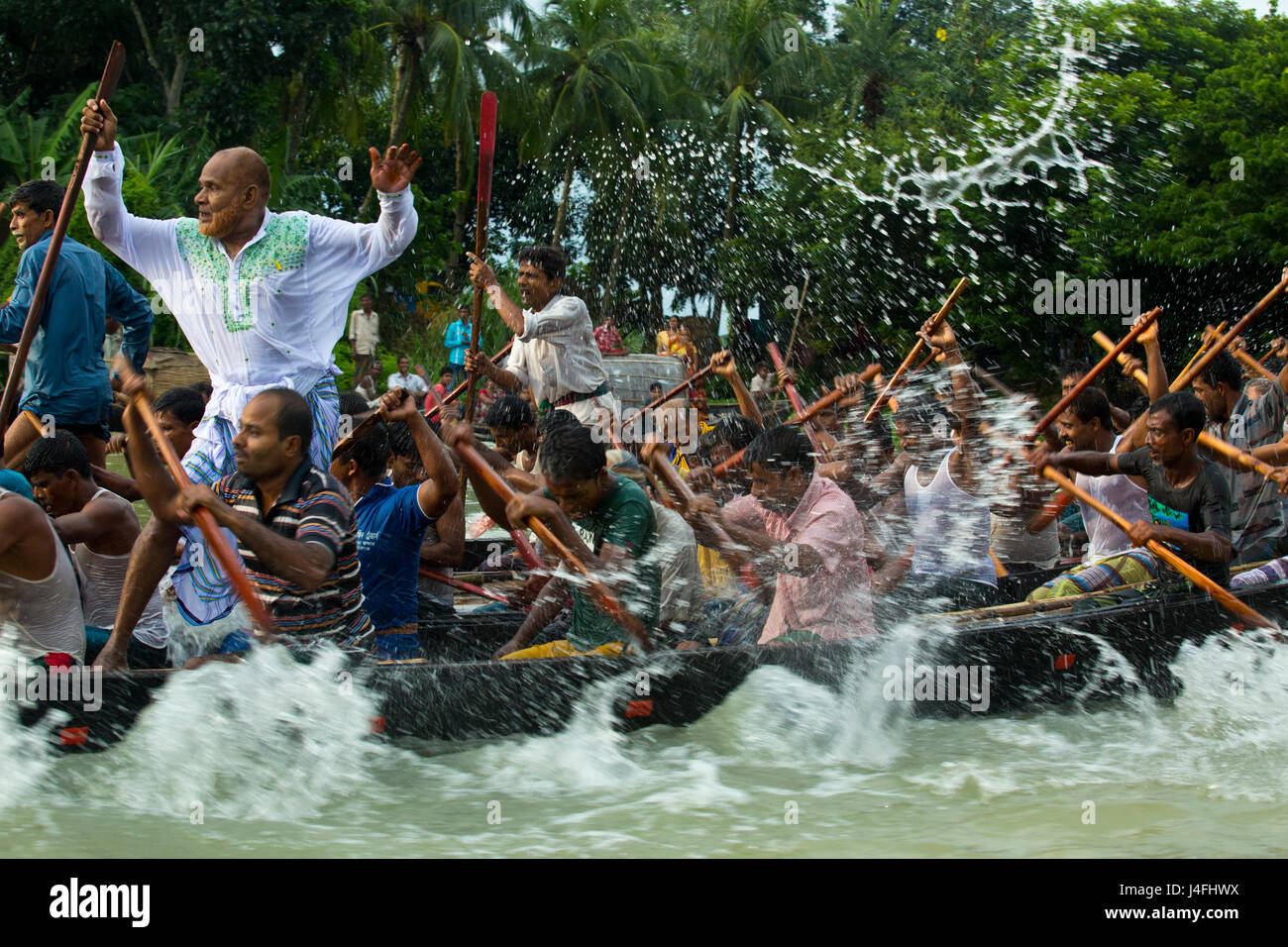 A traditional boat race is underway on the Ichamati River at Jhitka in ...
