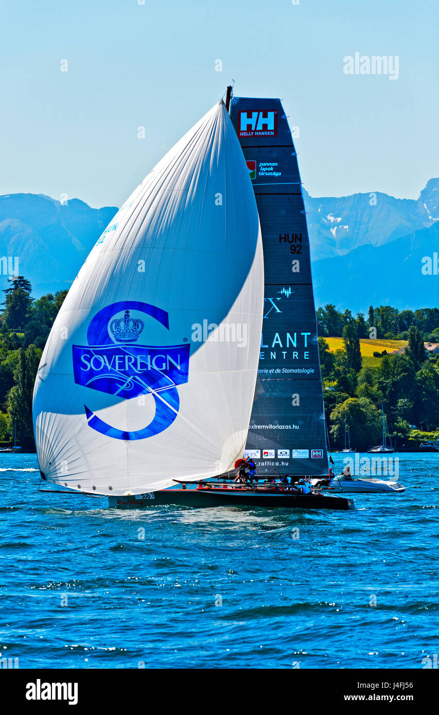 Sailing boat flying a spinnaker sail on Lake Geneva, boat HUN 92 ...