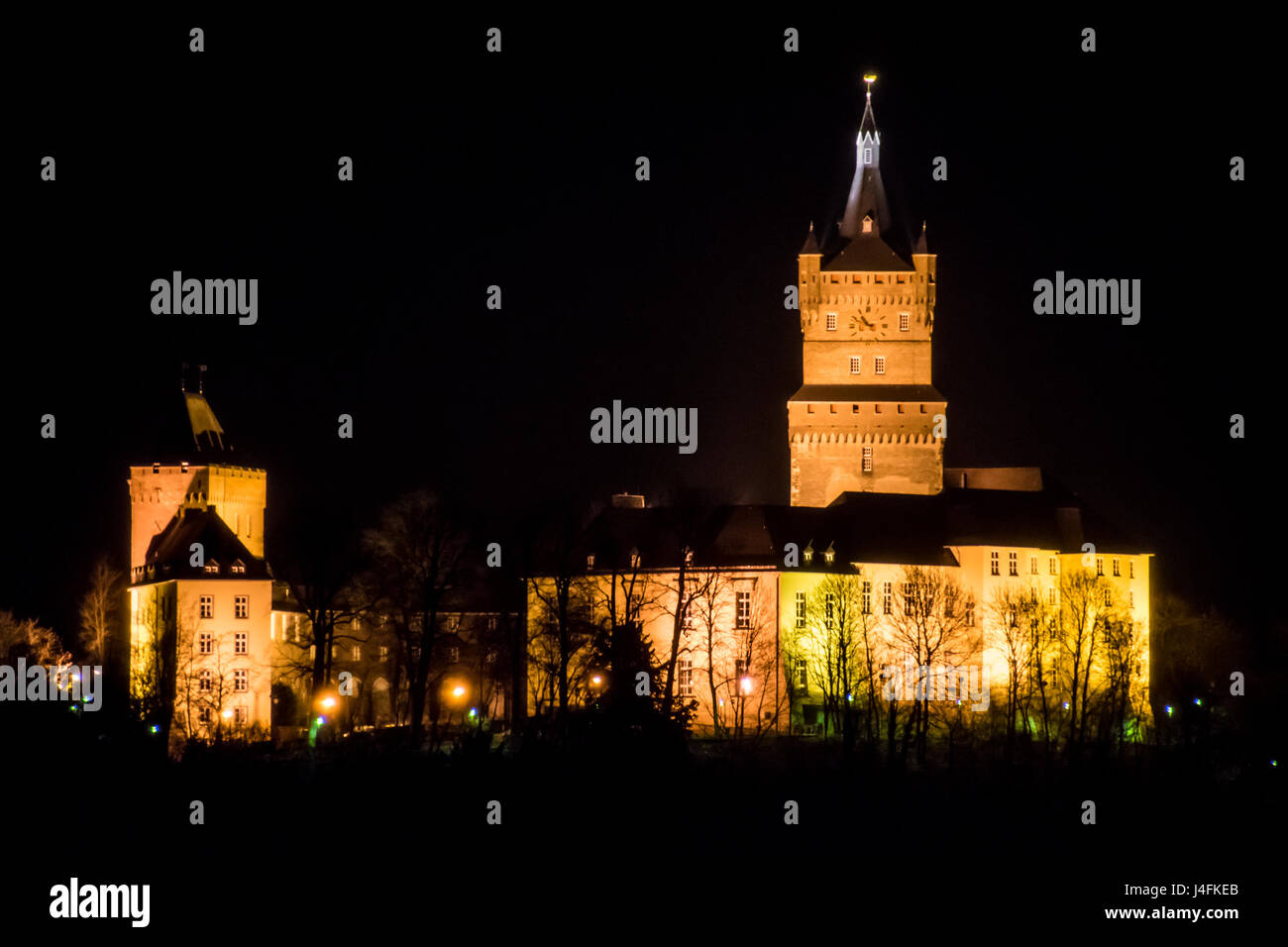 Old german castle tower clock palace at night Stock Photo - Alamy