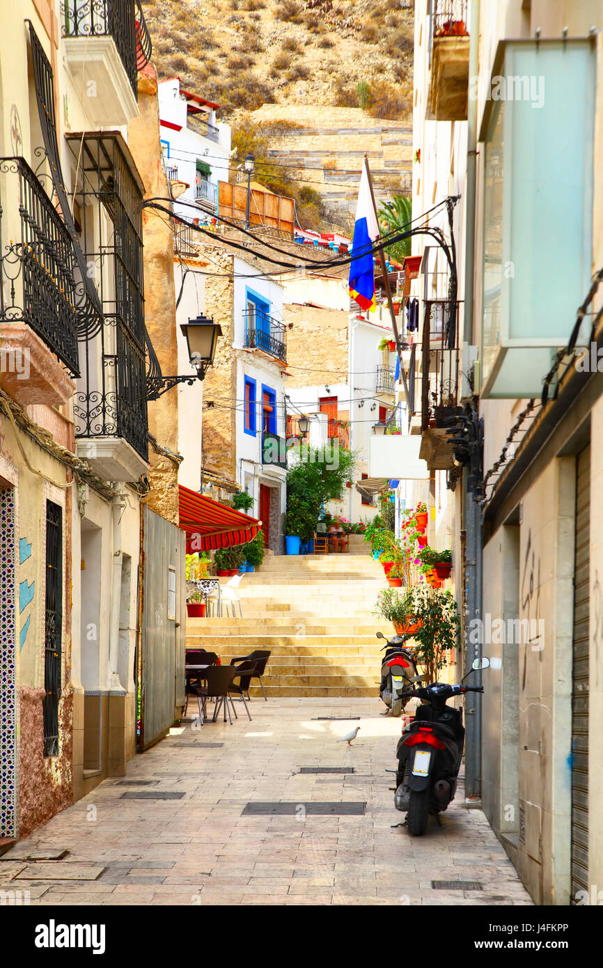Old uphill street in Alicante town, Spain Stock Photo - Alamy