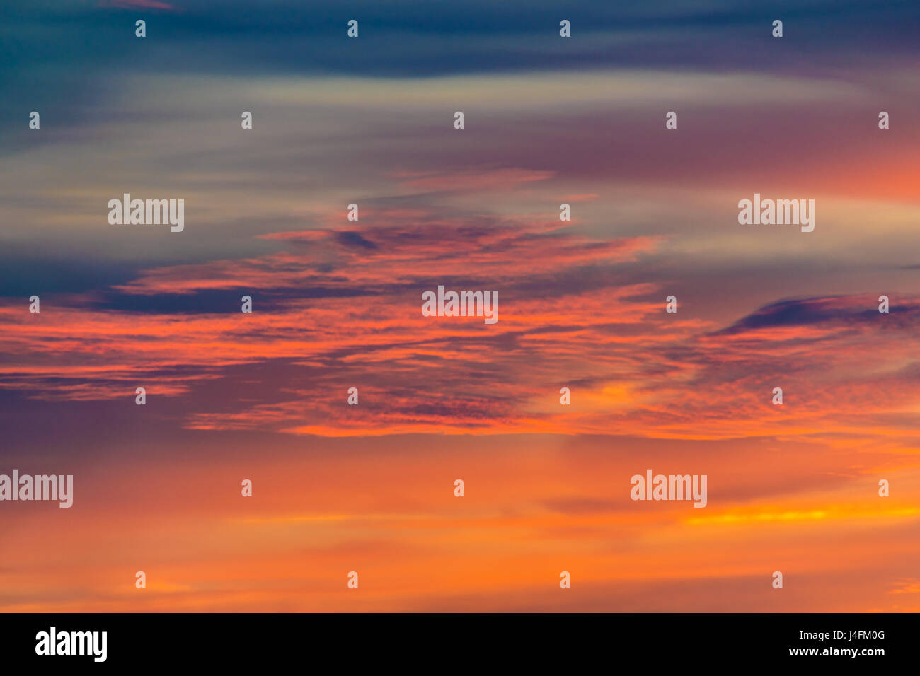 Blue red orange yellow sky sunset sunrise clouds Stock Photo - Alamy