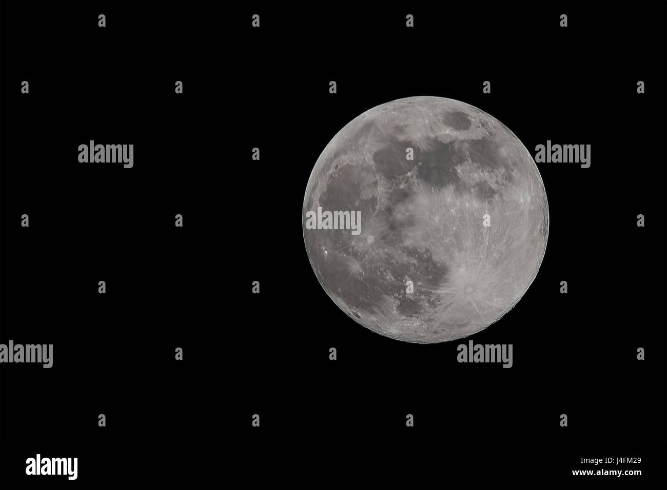 Fullmoon full moon april in night dark shining bright Stock Photo - Alamy