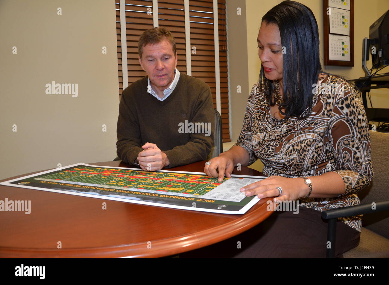 Pat Hogston, left, and Annette Logan review fiscal 2015 fourth quarter ...