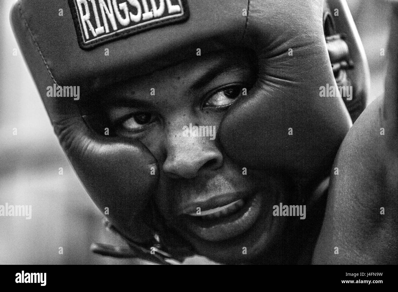 A boxer takes a breather between rounds during a boxing tournament at ...
