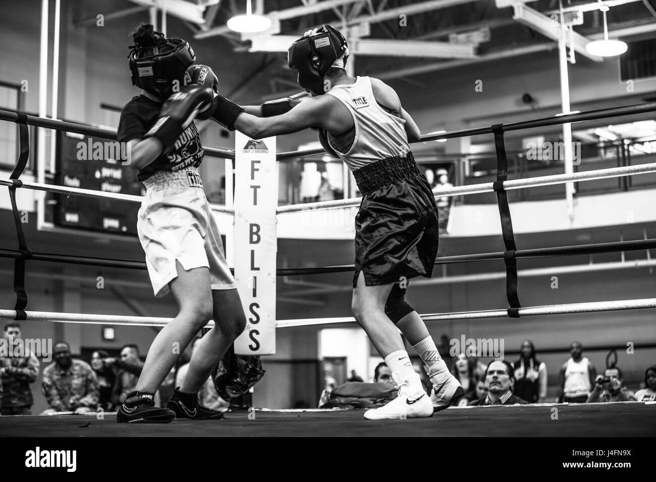Boxers trade blows during a boxing tournament at Fort Bliss, Texas, Feb ...