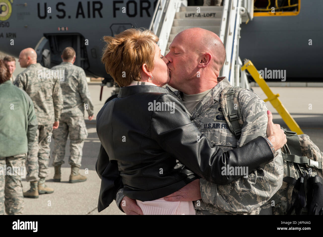 Lt. Col Joel Brecount, 434th Aircraft Maintenance commander, kisses his ...