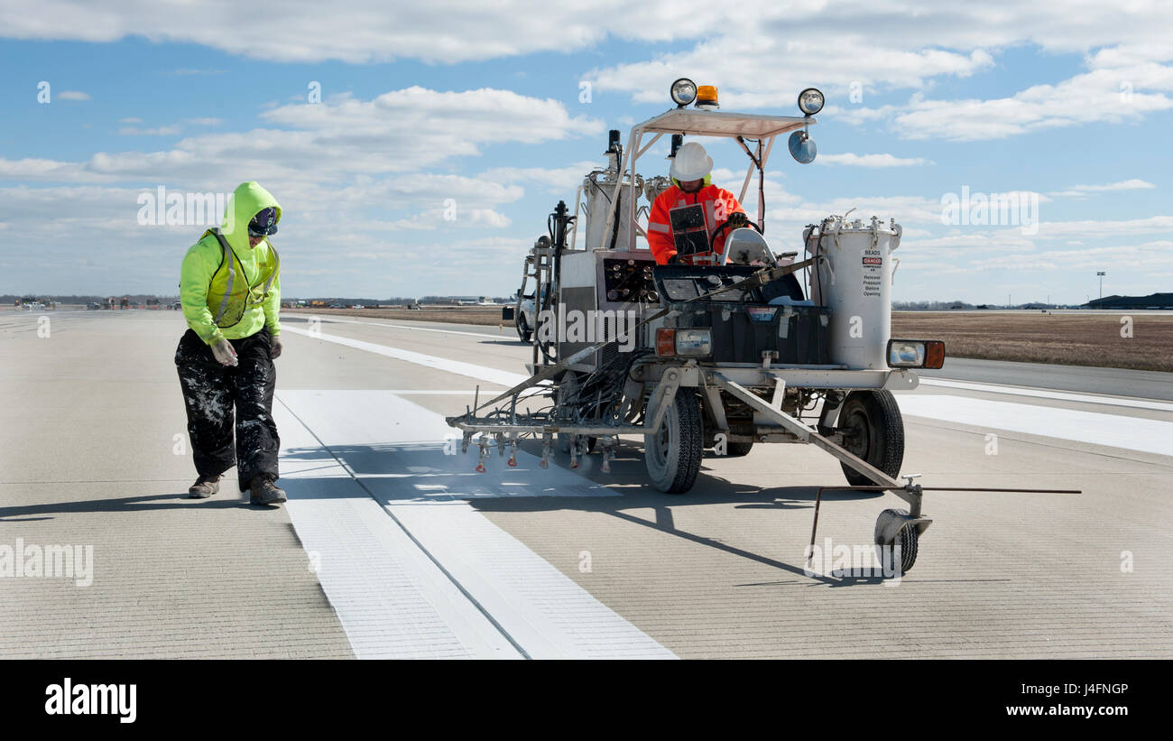 A crew from Mullen’s Markings repaints Runway 14-32 as part of an ...