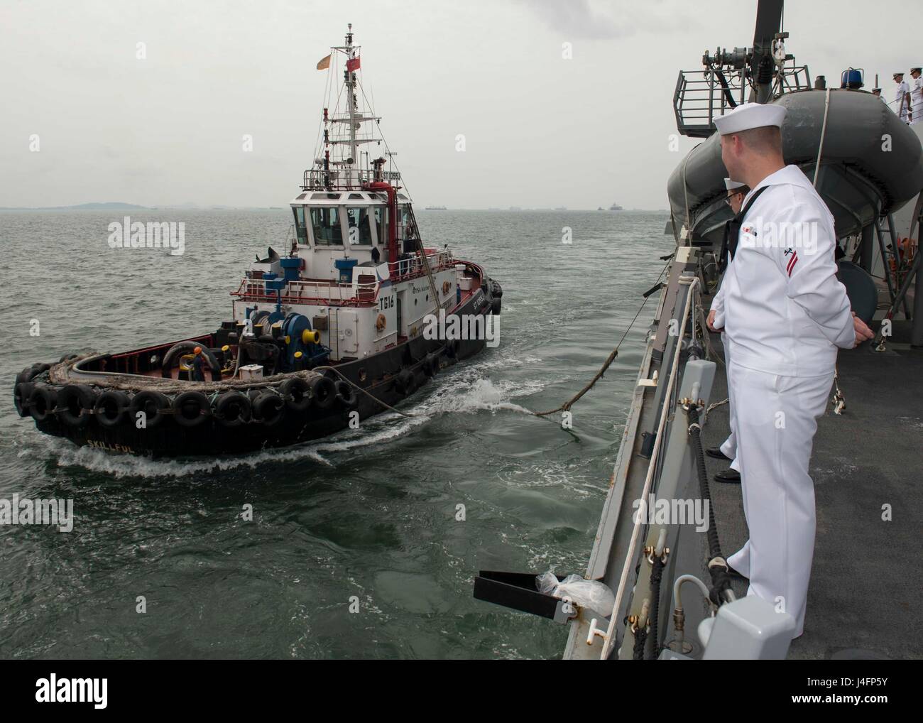 Sailors aboard USS Spruance (DDG 111) man the rails as a Singaporean ...