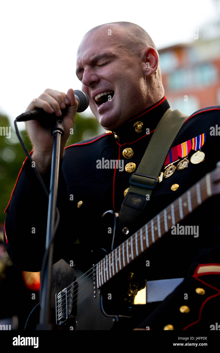 A U.S. Marine Corps Staff Sergeant performs vocals with Marine Band San ...