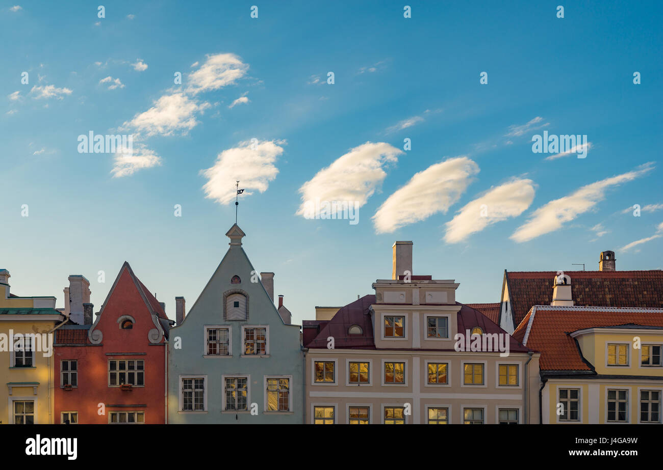 Colorful medieval houses against wonderful morning sky and clouds. Cozy ...