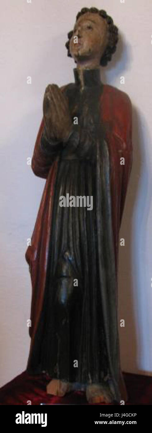 A sculpture of a deacon, likely representing a religious figure ...