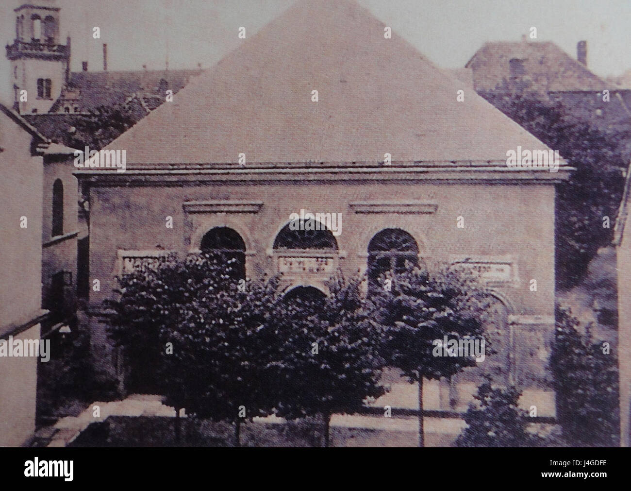 This image depicts a 19th-century synagogue, showcasing architectural ...