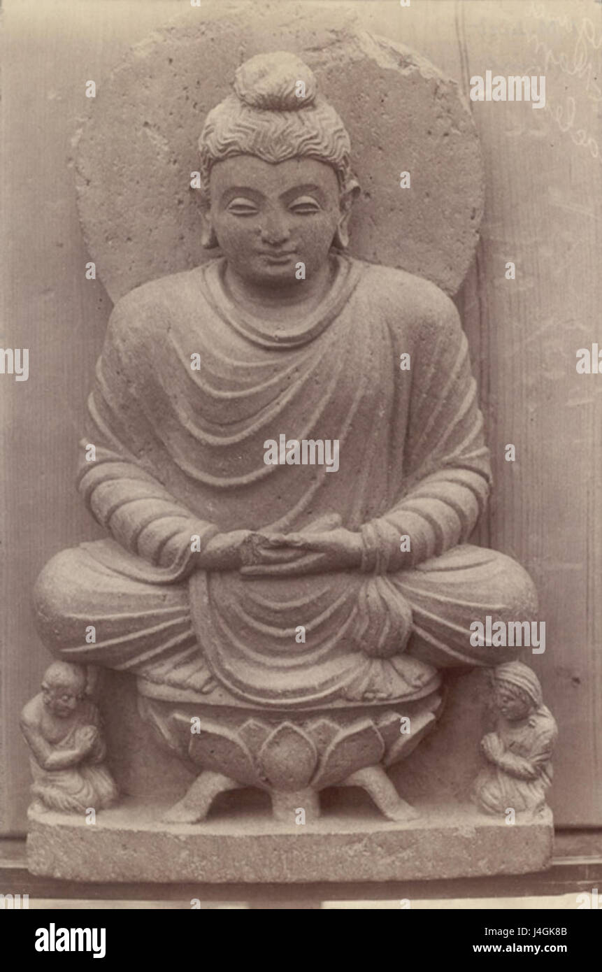 A statue of Buddha seated on a lotus throne from the Swat Valley ...