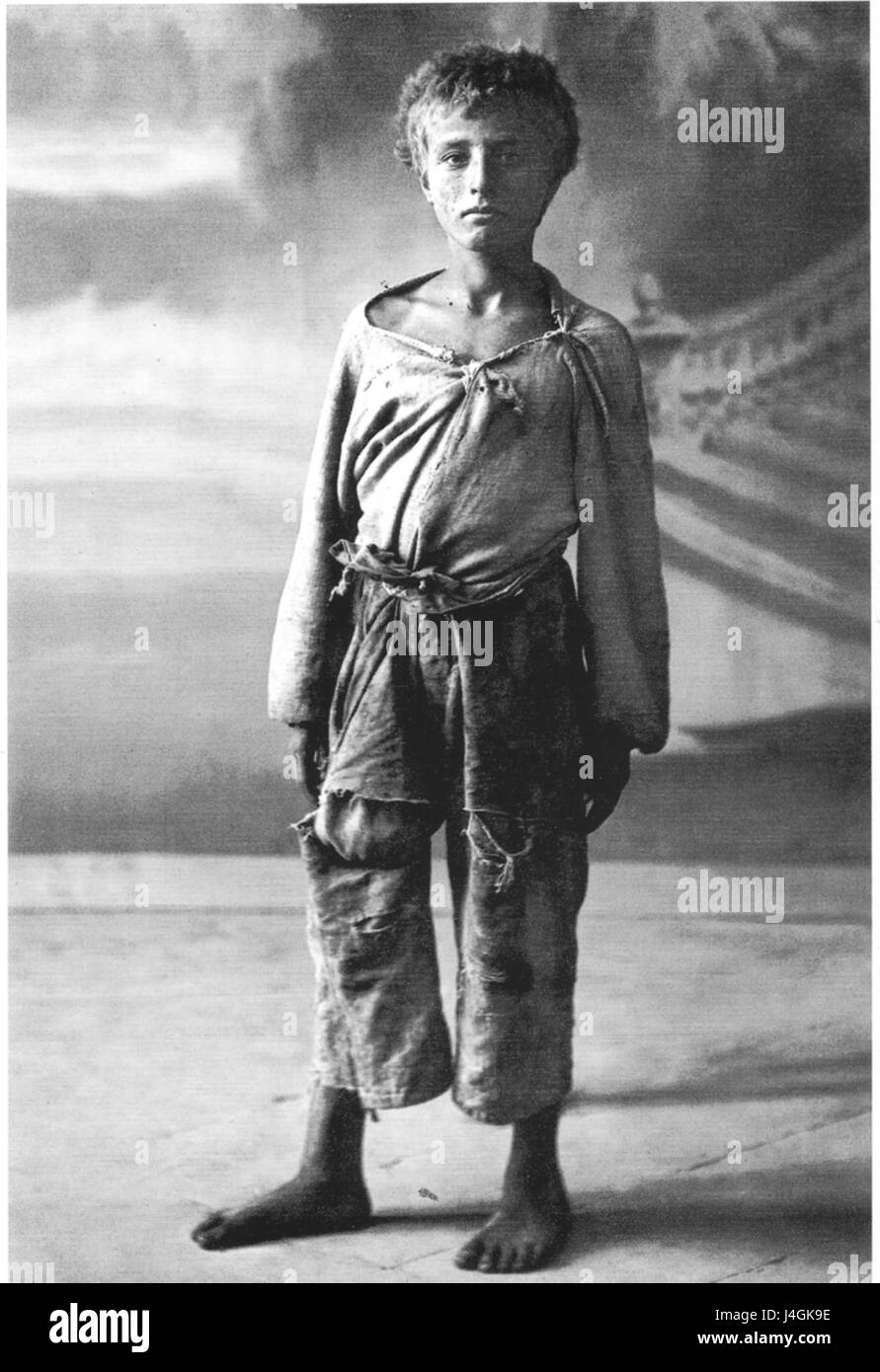 Boy in rags Black and White Stock Photos & Images - Alamy
