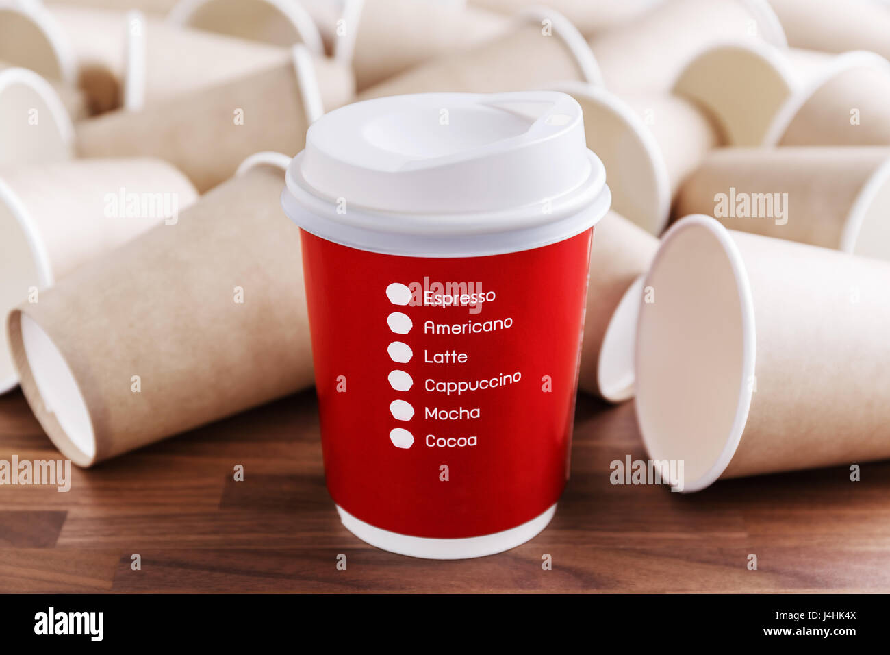 Red paper coffee cup with brown paper cups background Stock Photo - Alamy
