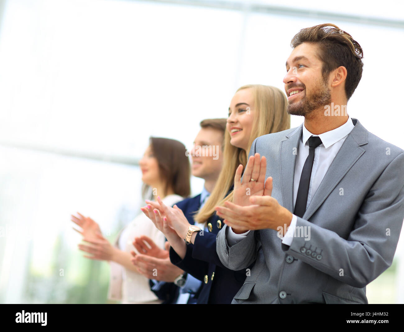 Satisfied proud business team clapping hands Stock Photo - Alamy
