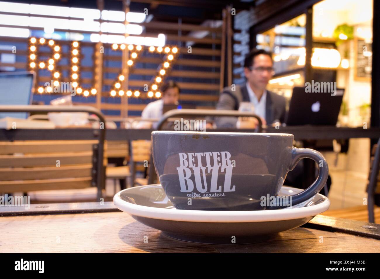 Coffee at Better Buzz Cafe, in the background people working on their ...