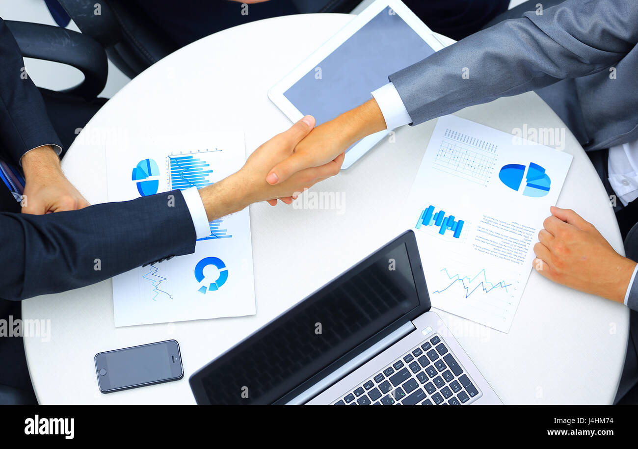 Businessmen shaking hands. Top View Stock Photo - Alamy
