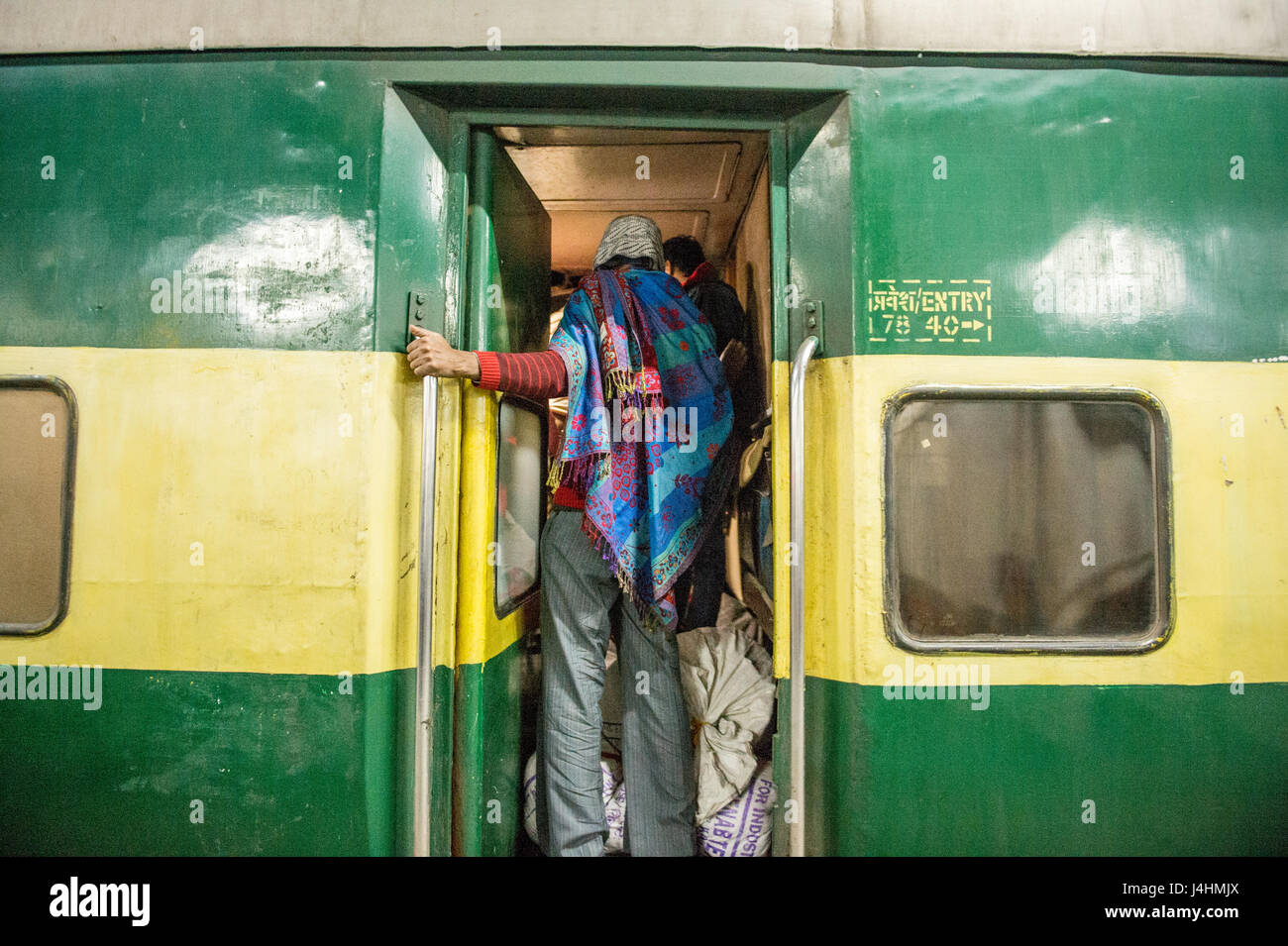 Passengers boarding a train at the Ludhiana Junction railway station in ...