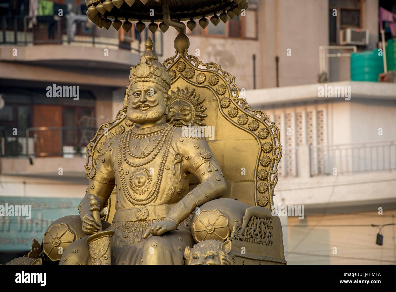 A gold statue of an Indian god is proudly displayed in downtown Agra ...