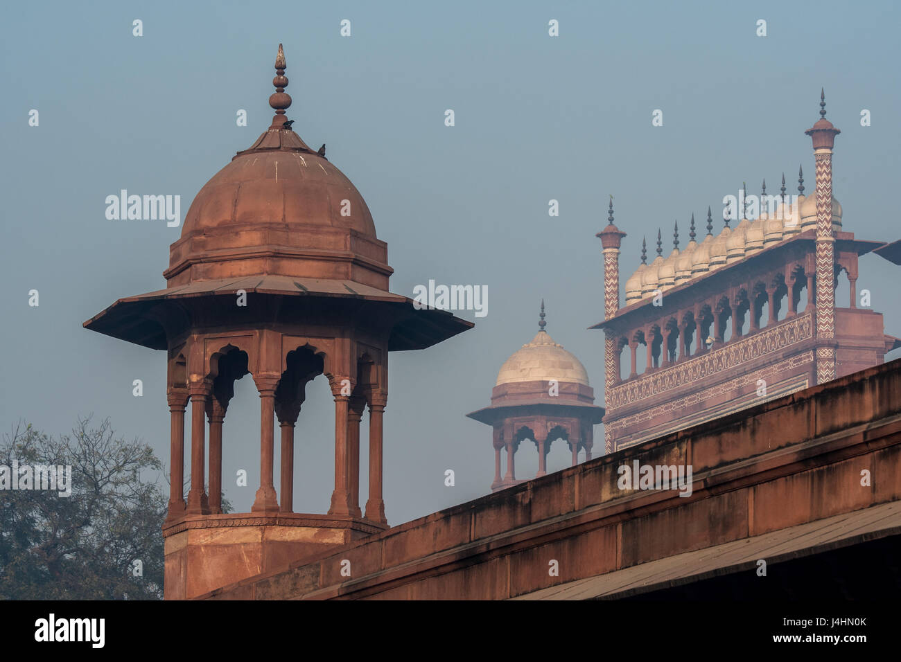 Domes line the top of the crenellated wall at the main entrance of the ...