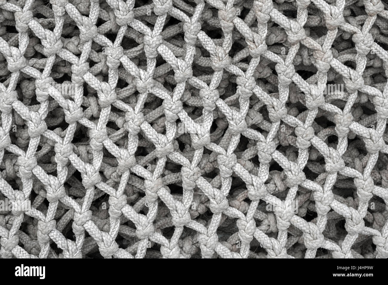 Meshes of a gray fishing net Stock Photo - Alamy