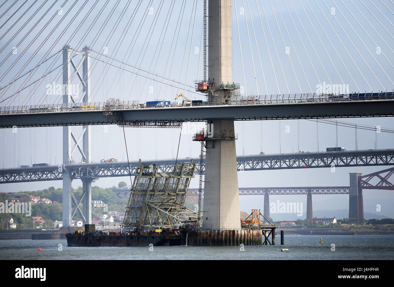 The final temporary support strut is removed from under the south tower ...