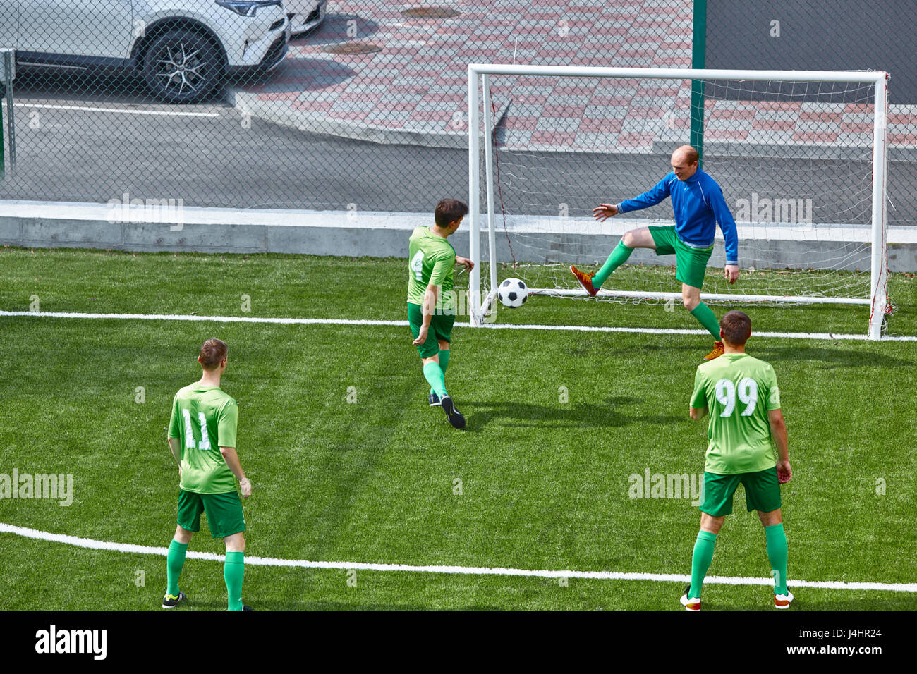 Soccer football goalkeeper making diving save Stock Photo - Alamy