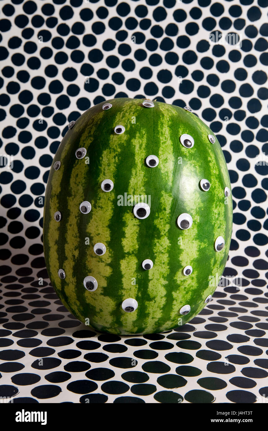 watermelon transform into a freak on a dots background Stock Photo - Alamy