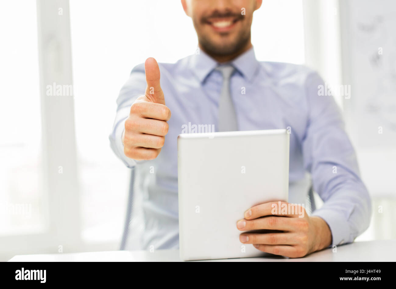 Businessman working computer thumbs up hi-res stock photography and ...